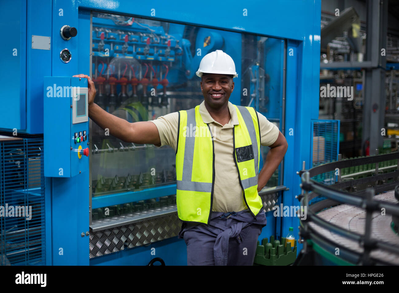 Smiling factory worker leaning hi-res stock photography and images - Alamy