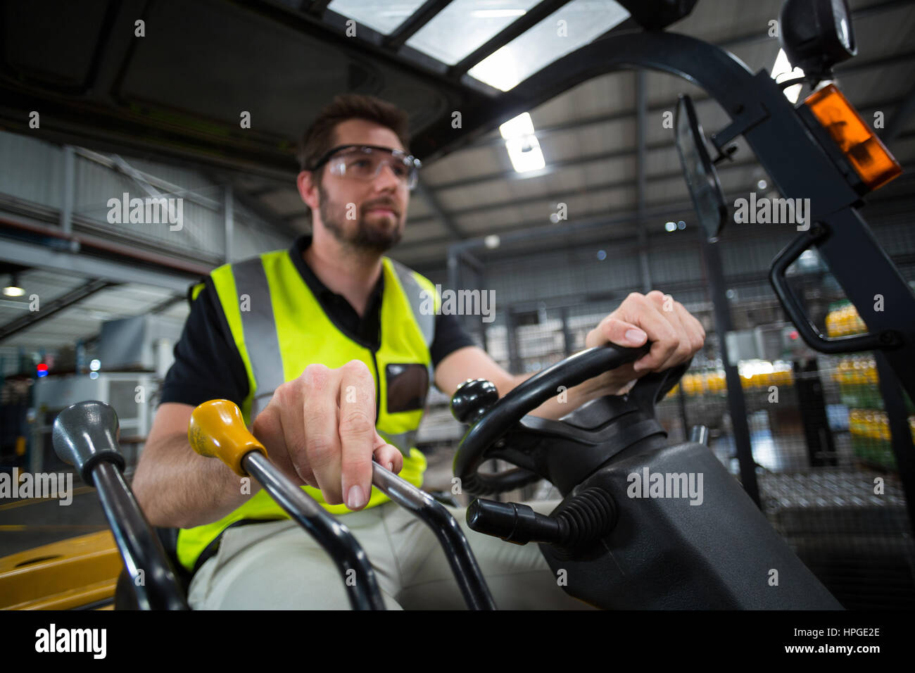 Worker driving forklift hi-res stock photography and images - Alamy