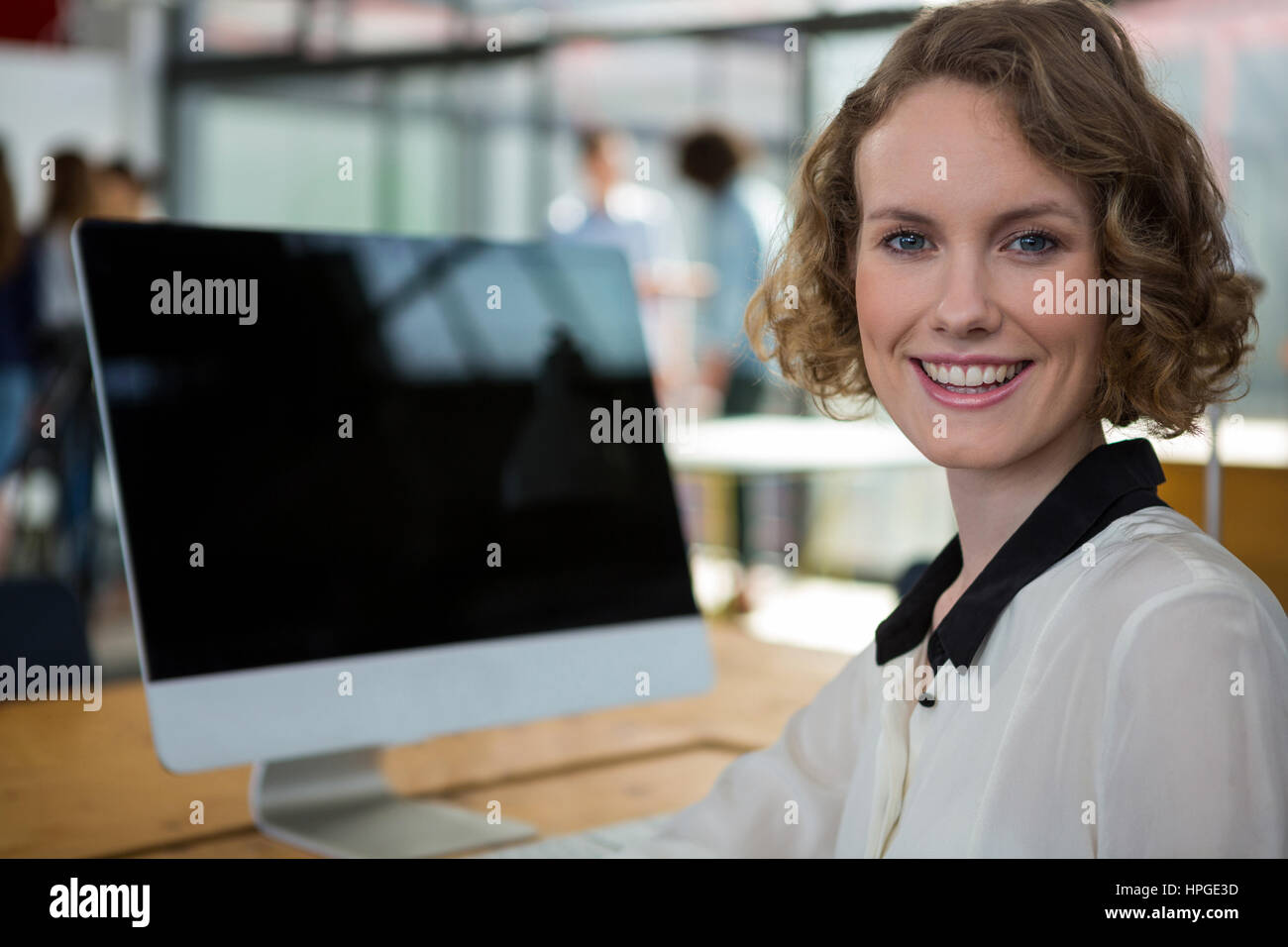 Portrait of female graphic designers smiling Stock Photo - Alamy