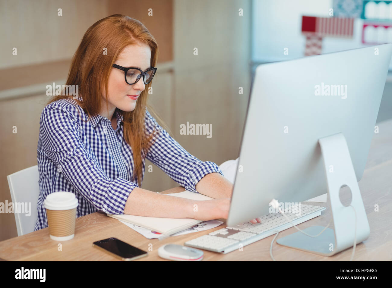 Female executive working on computer in office Stock Photo - Alamy