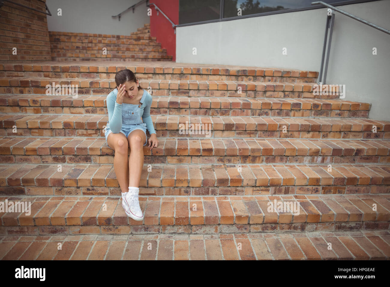 Sad Girl Sitting On Stairs High Resolution Stock Photography and Images ...