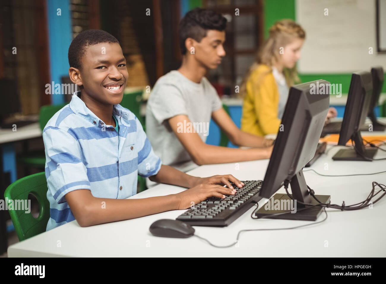 Students studying in computer classroom at school Stock Photo - Alamy
