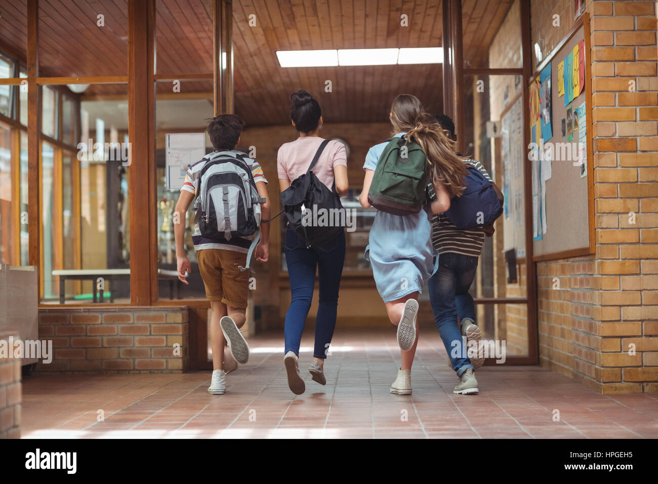 Running teenager school hi-res stock photography and images - Alamy