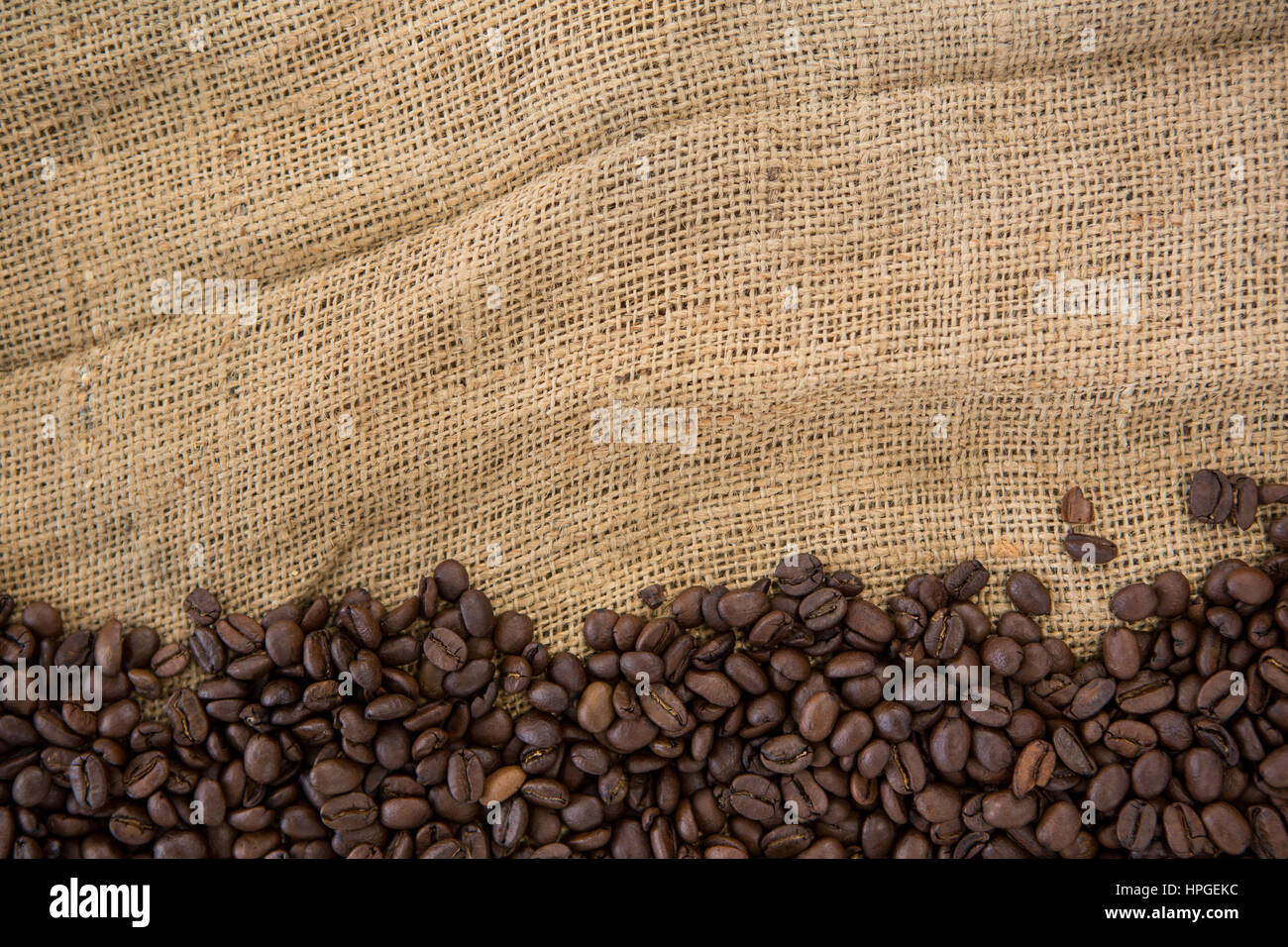 Coffee beans arranged on sack textile Stock Photo - Alamy