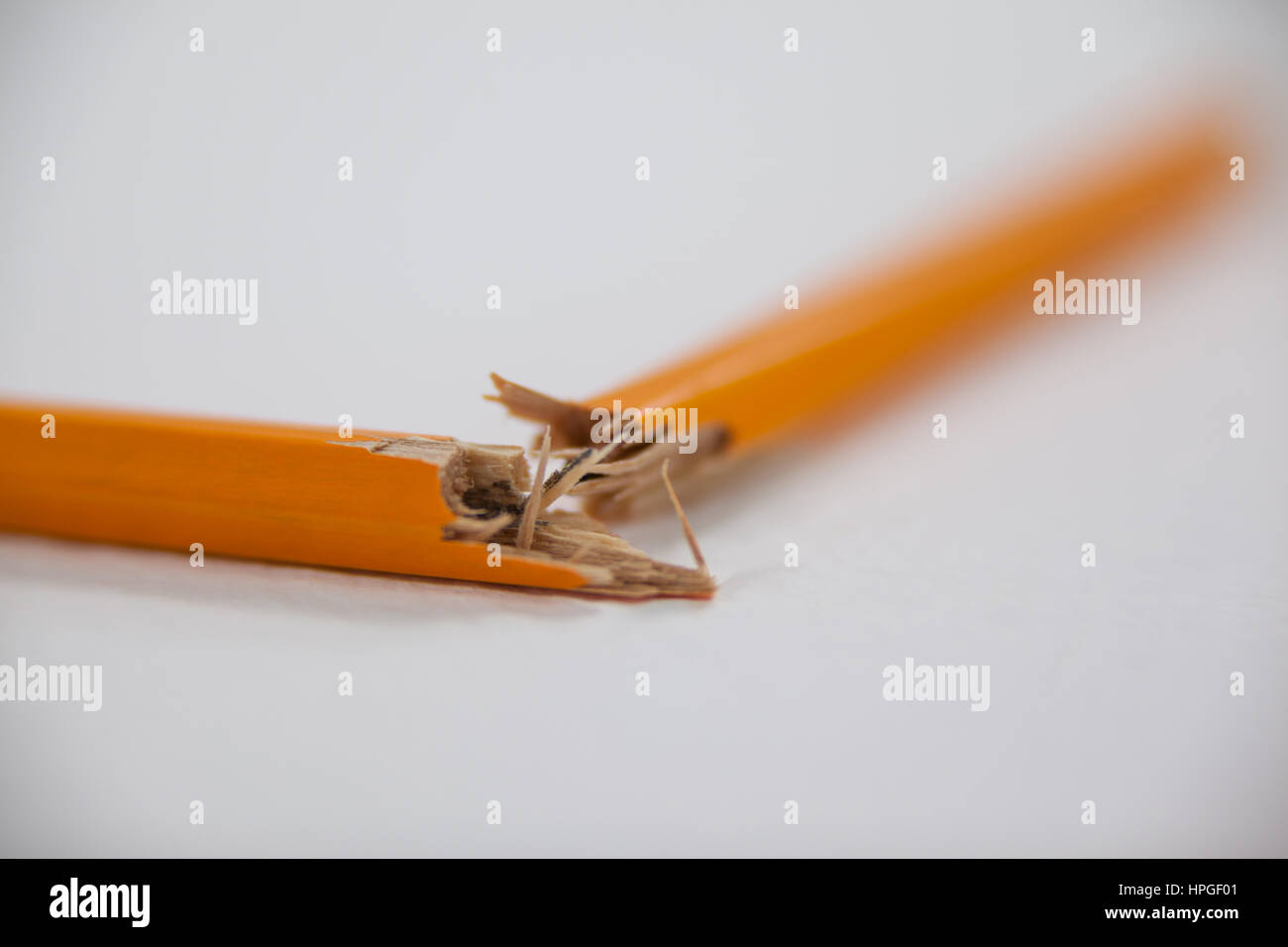 Close-up of broken pencil on white background Stock Photo - Alamy