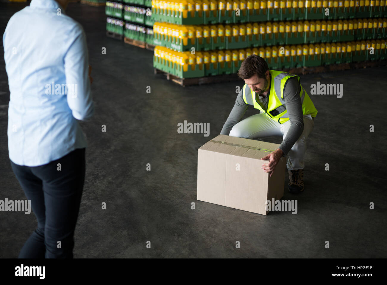 Woman picking up boxes hi-res stock photography and images - Alamy