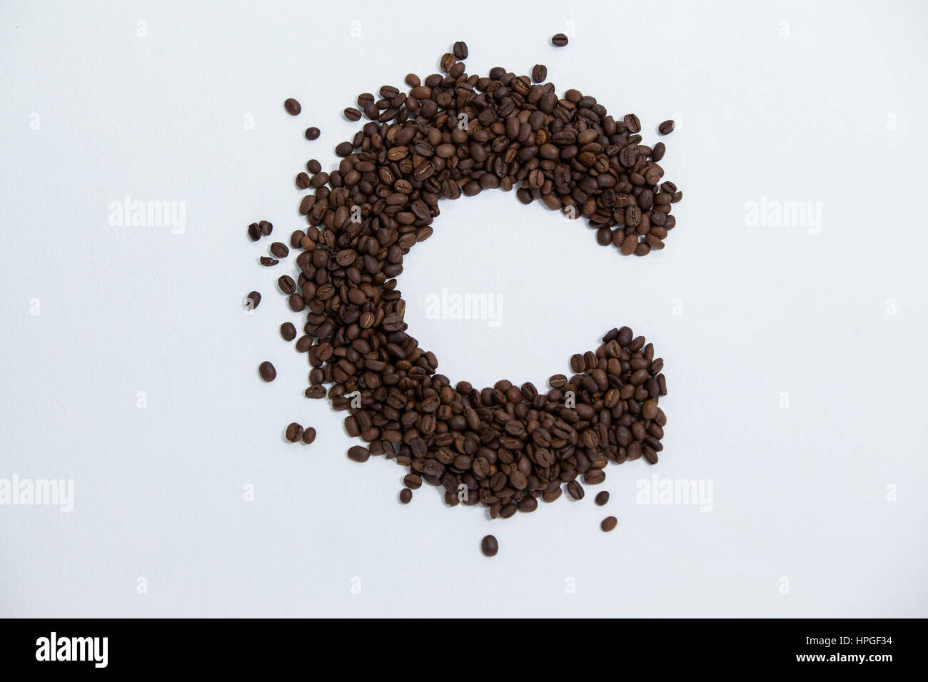 Coffee beans forming alphabet C on white background Stock Photo - Alamy