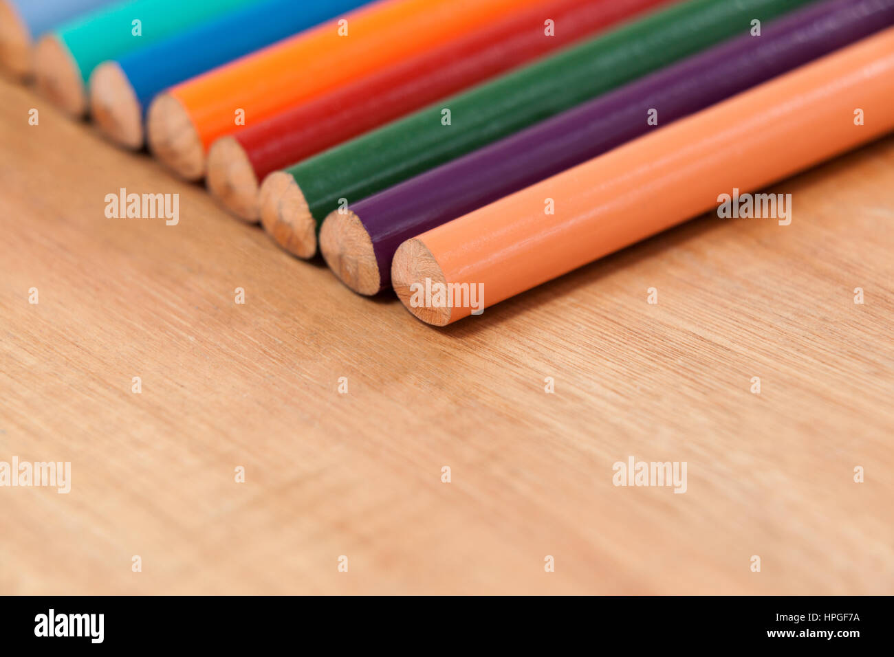 Close-up of colored pencil in a row on white background Stock Photo - Alamy