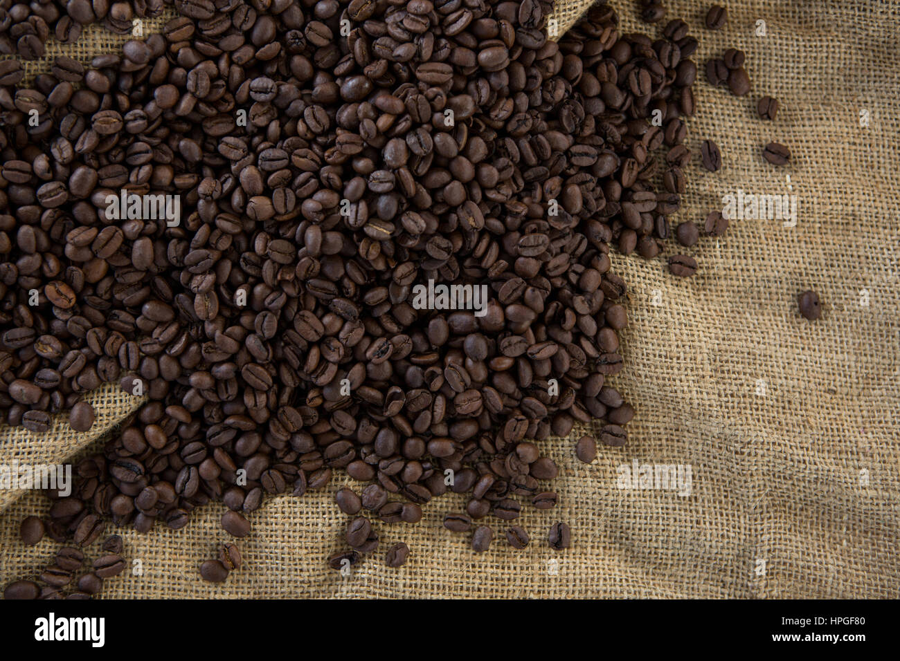 Roasted coffee beans on sack textile Stock Photo - Alamy