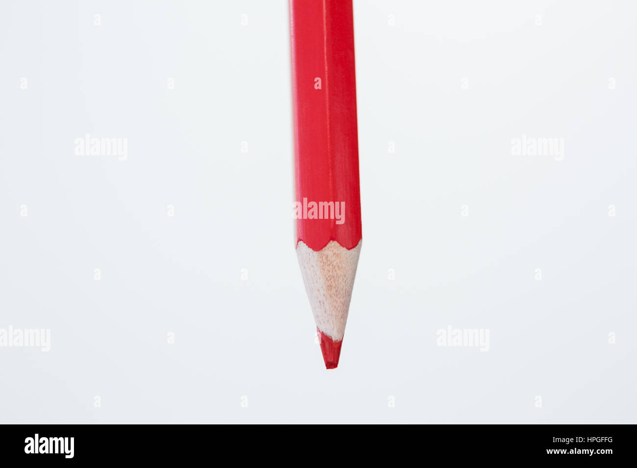 Close-up of red color pencil on white background Stock Photo - Alamy