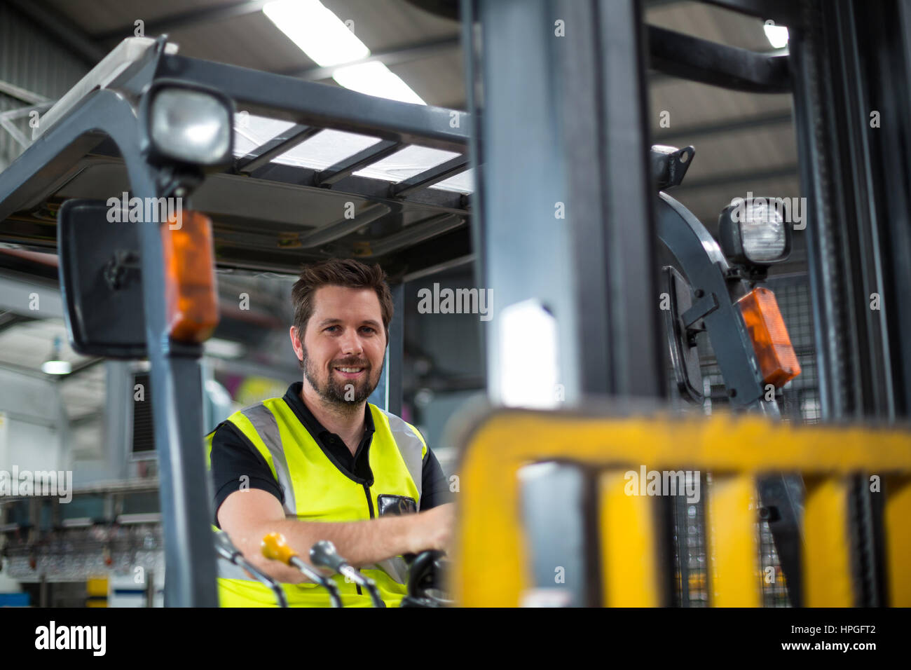 Handsome smiling worker driving hi-res stock photography and images - Alamy