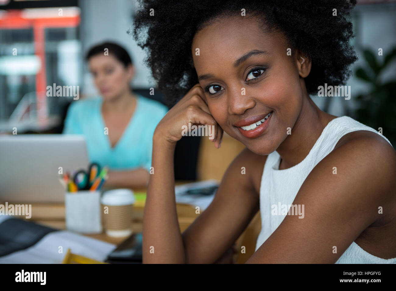 Portrait of female graphic designer smiling Stock Photo - Alamy