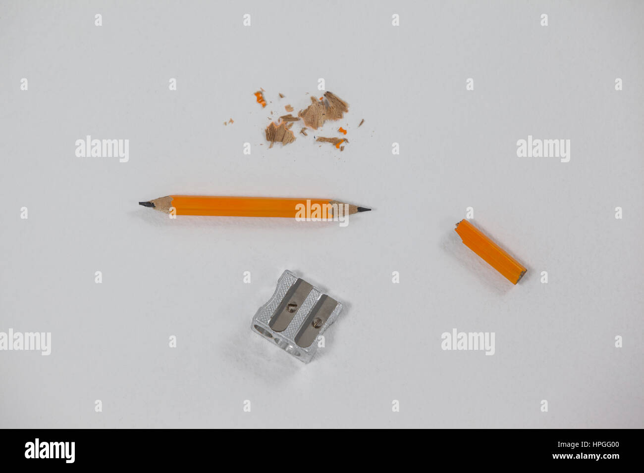 Close-up of broken pencil and sharpener on white background Stock Photo ...