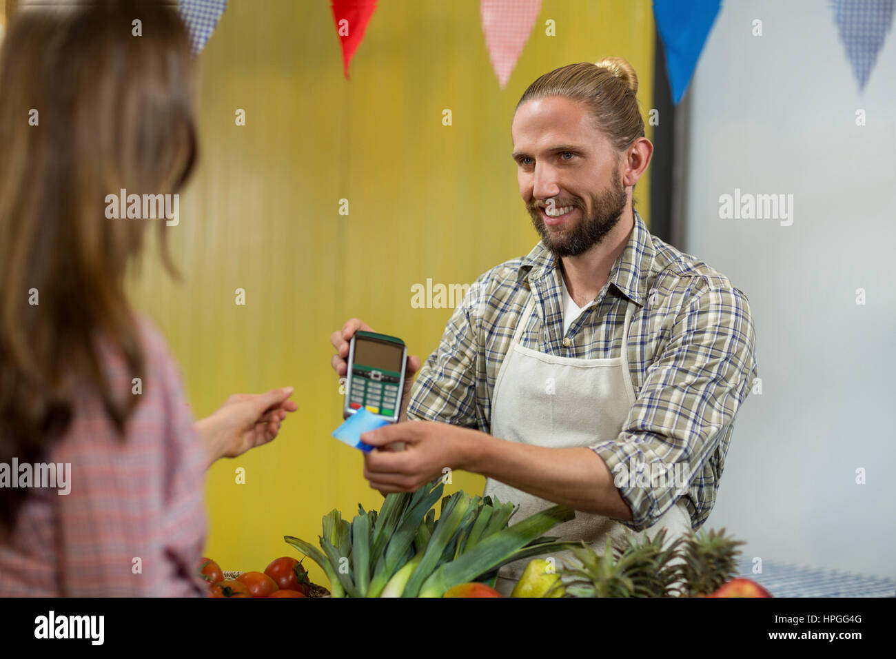 Woman paying grocery using hi-res stock photography and images - Alamy