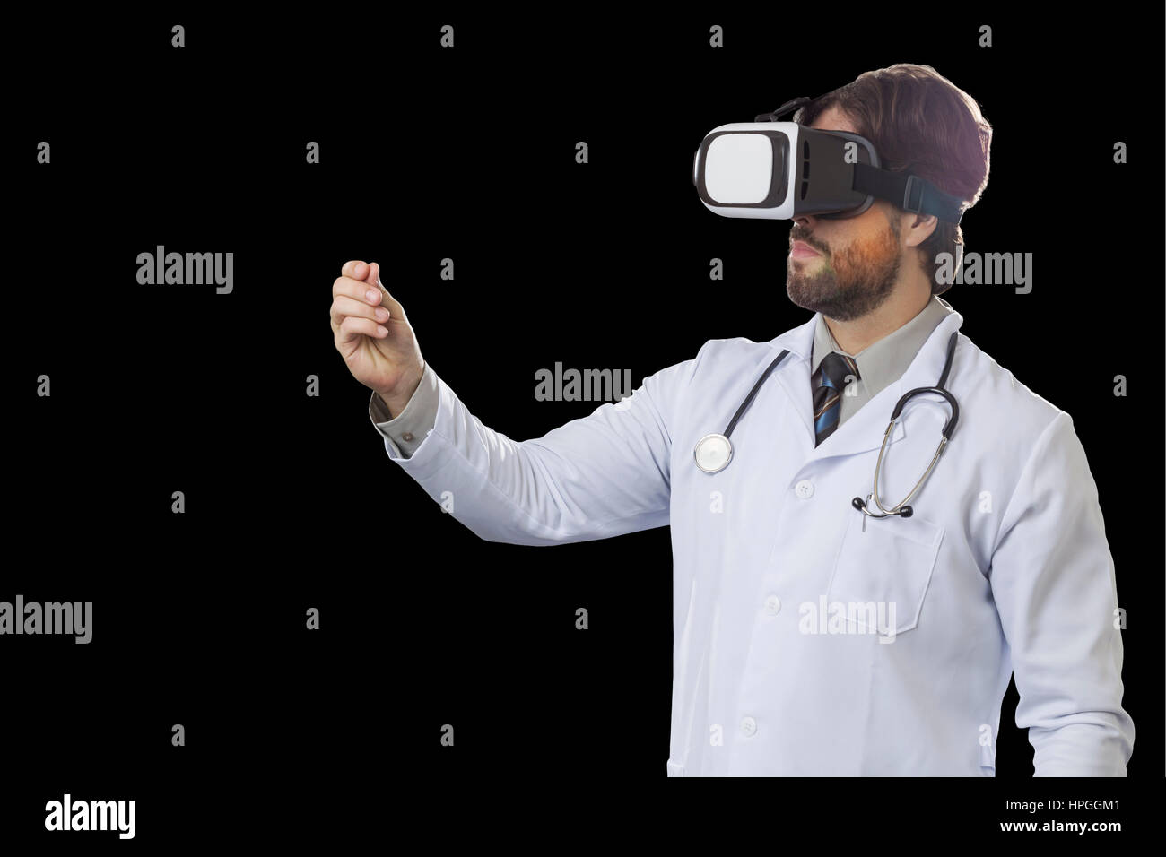Male doctor using a Virtual Reality Glasses on a black background Stock ...