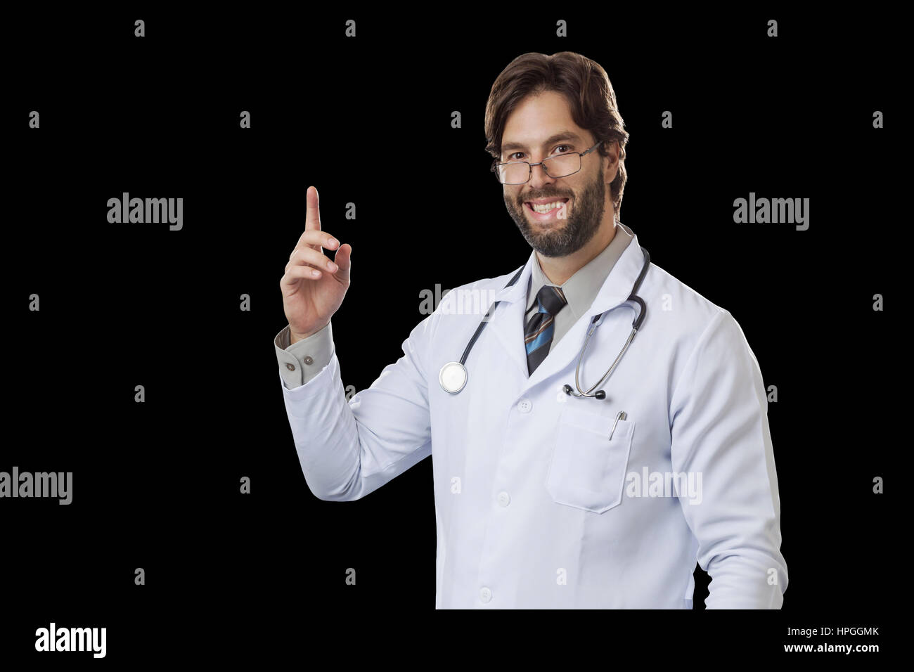 Male doctor Pointing up on a black background Stock Photo - Alamy