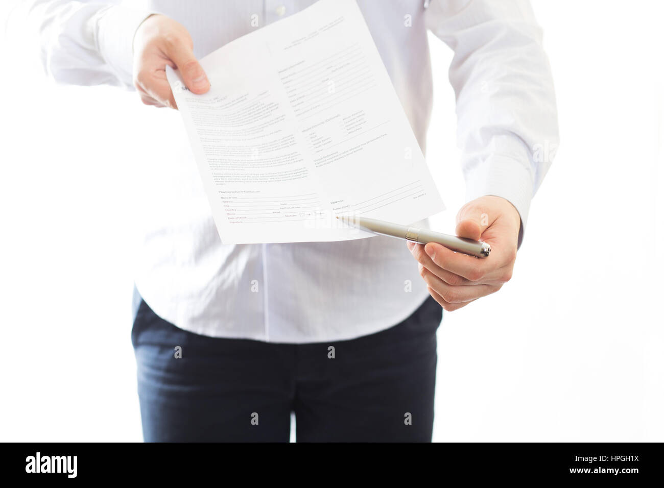 Businessman giving contract ready to sign Stock Photo - Alamy