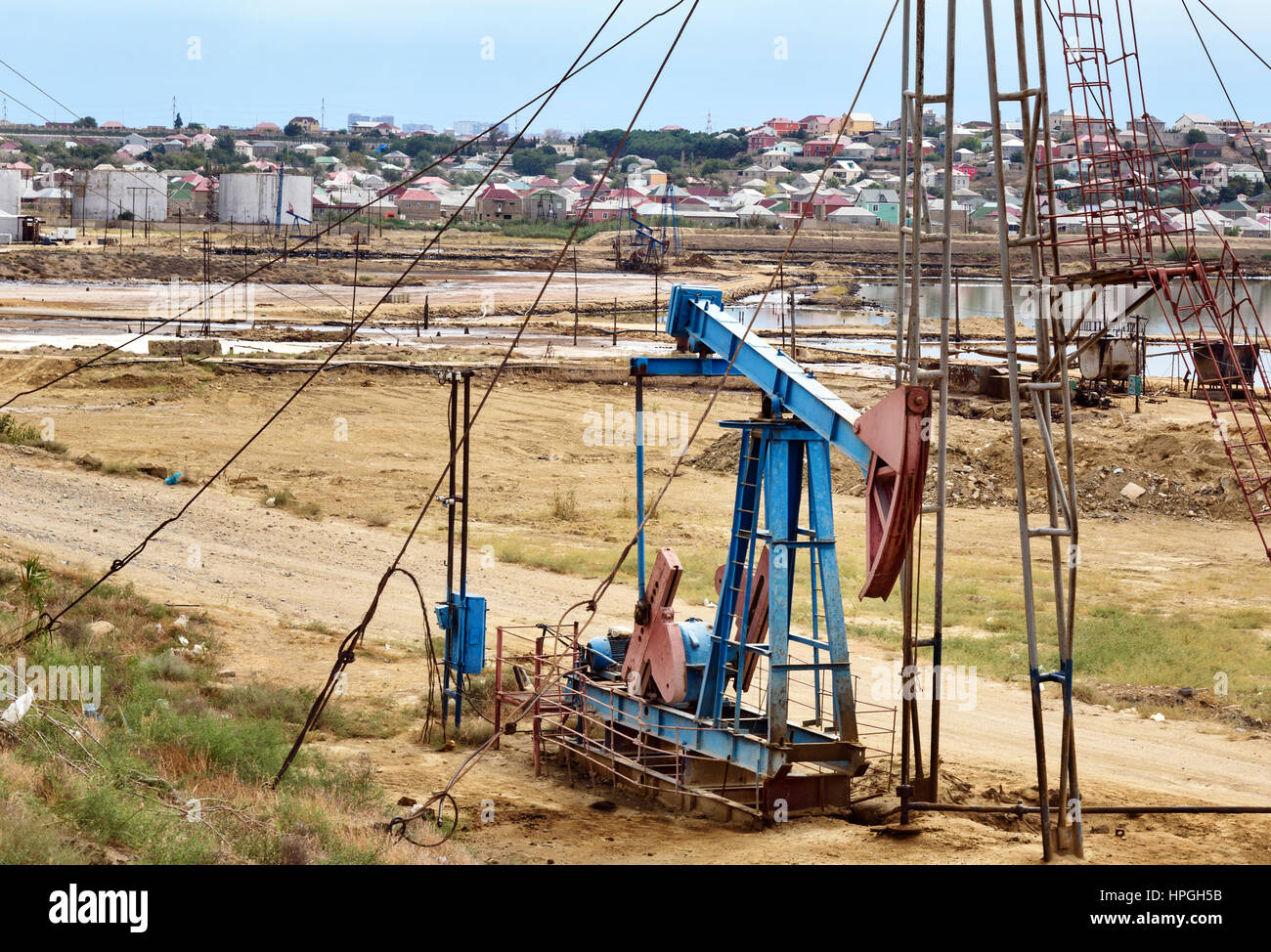 Oil derrick on oil field in village near Baku. Azerbaijan Stock Photo ...