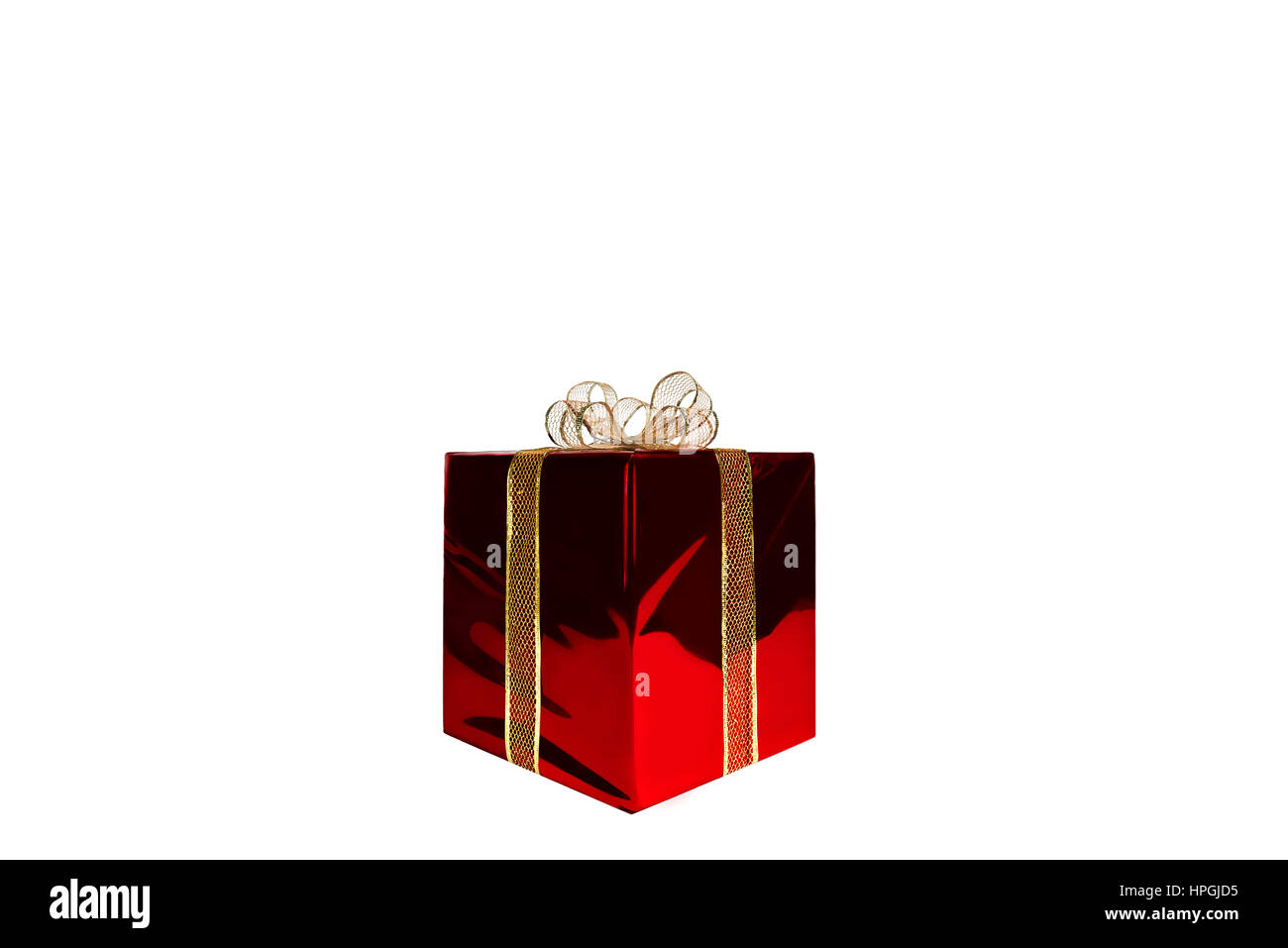 Decorated red color gift box with golden ribbon Stock Photo - Alamy
