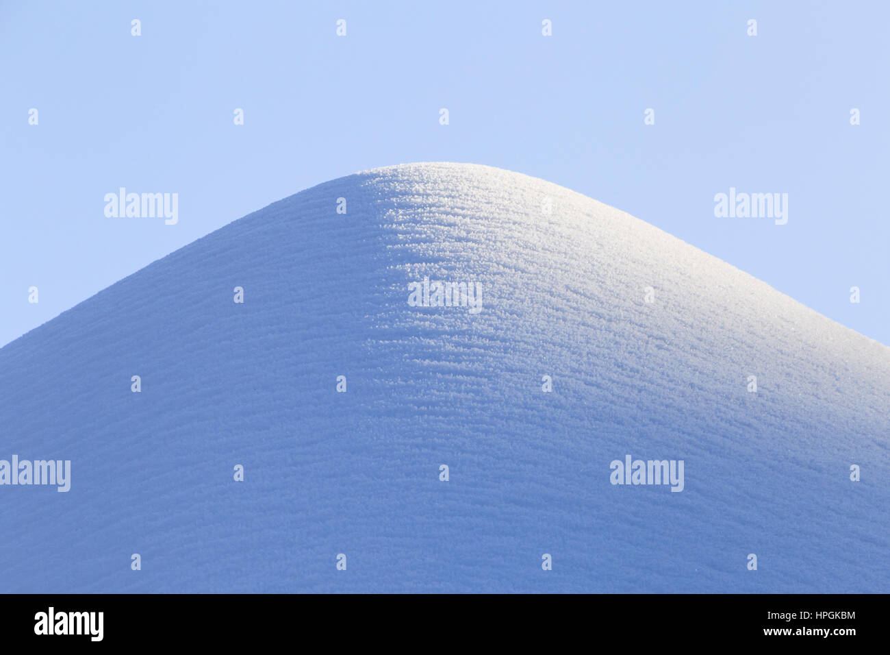 heap of snow over blue sky Stock Photo - Alamy