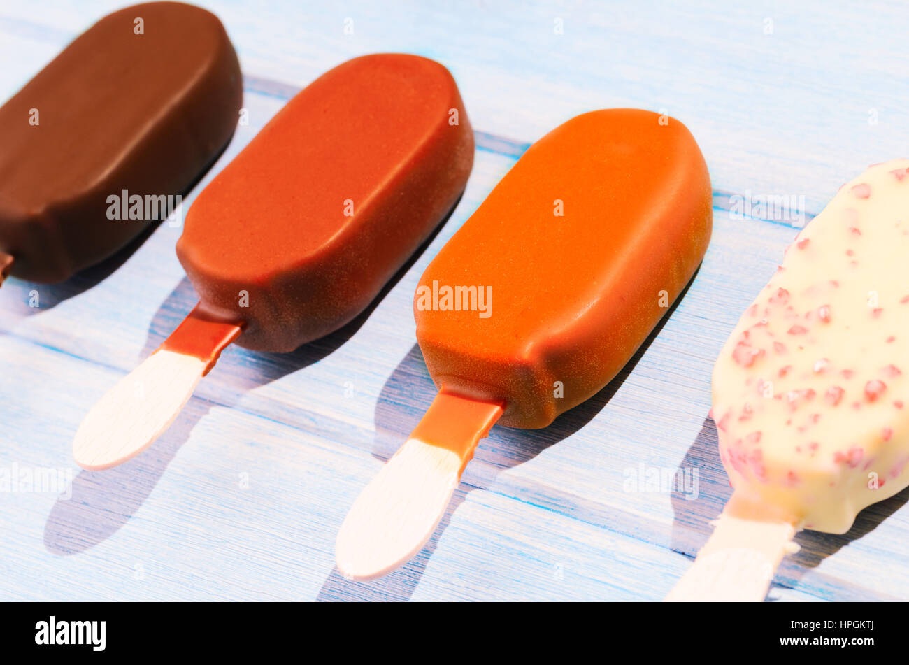 Ice creams on wooden background hi-res stock photography and images - Alamy