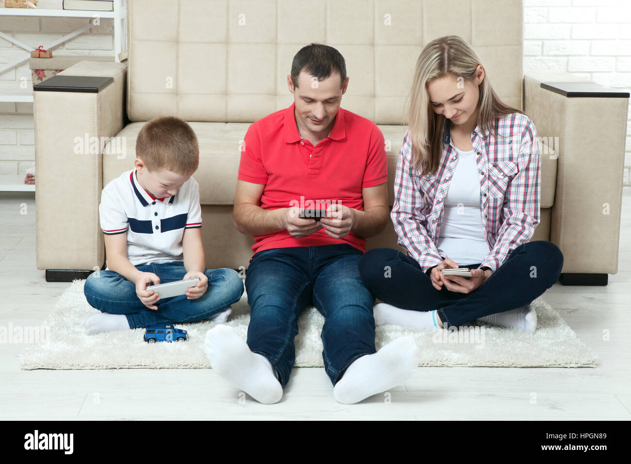 Family having fun chating on internet with laptop. Family having fun ...