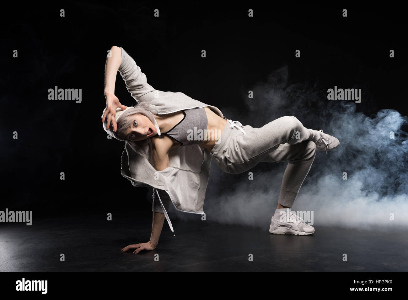 woman in sports clothing break dancing Stock Photo - Alamy