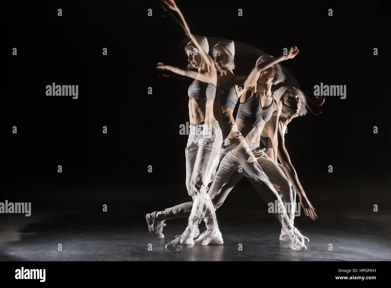 woman in sports clothing dancing Stock Photo - Alamy