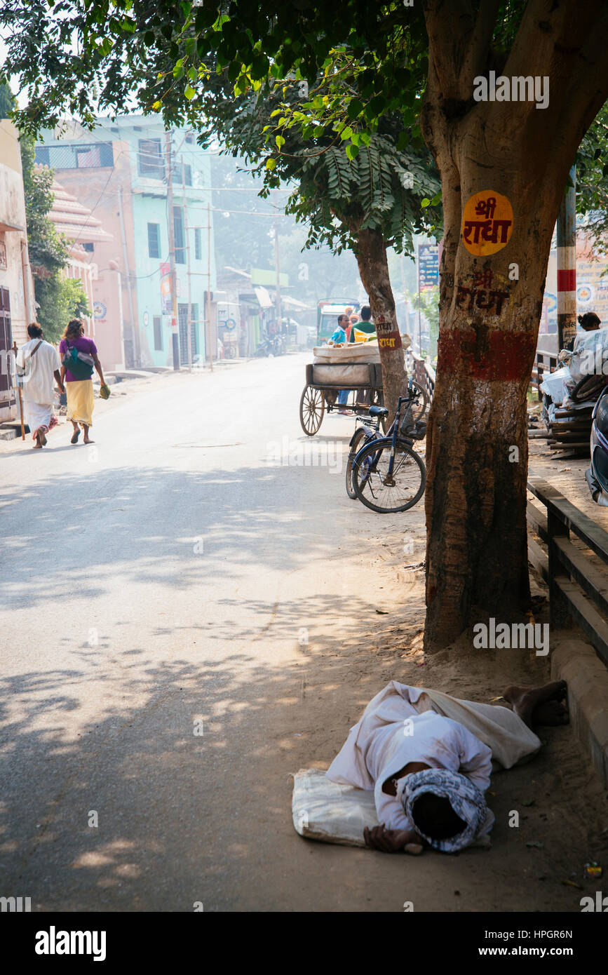 Pilgrim sleeping under a tree, India Stock Photo - Alamy