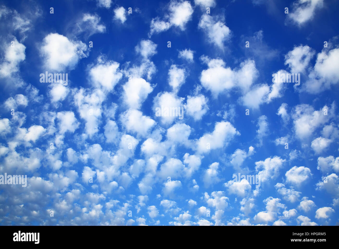 Deep blue sky with clouds, may be used as background Stock Photo - Alamy