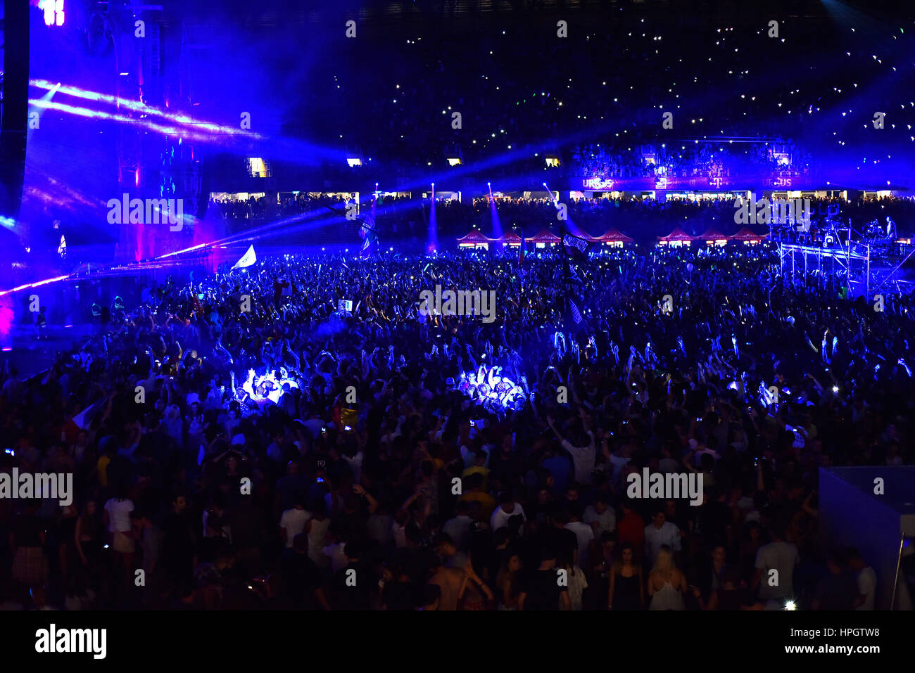 CLUJ NAPOCA, ROMANIA - AUGUST 7, 2016: Crowd of people having fun and dancing during a Dj W&W ...