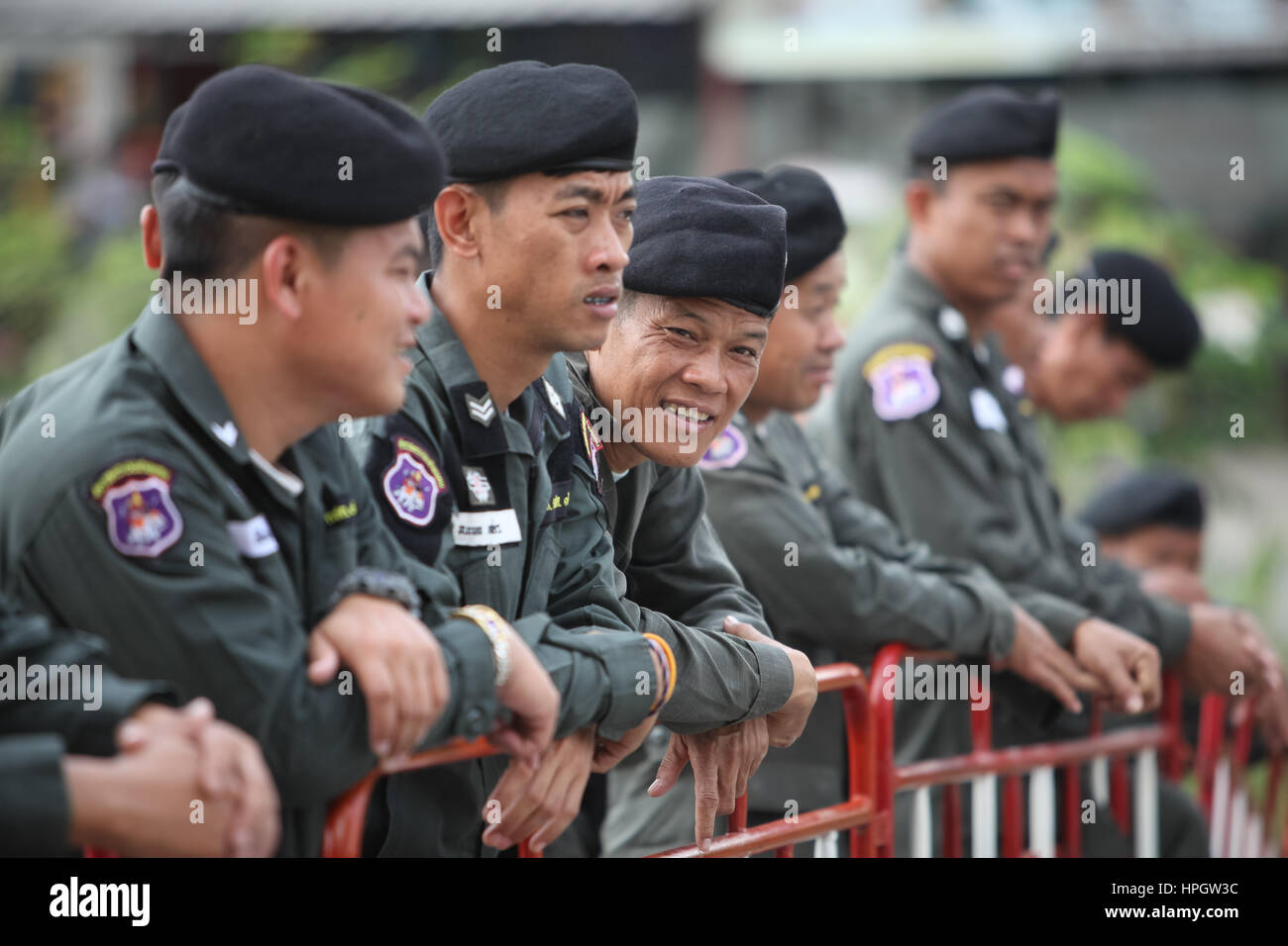 Police stand outside Dhammakaya Buddhist temple while are blocking ...