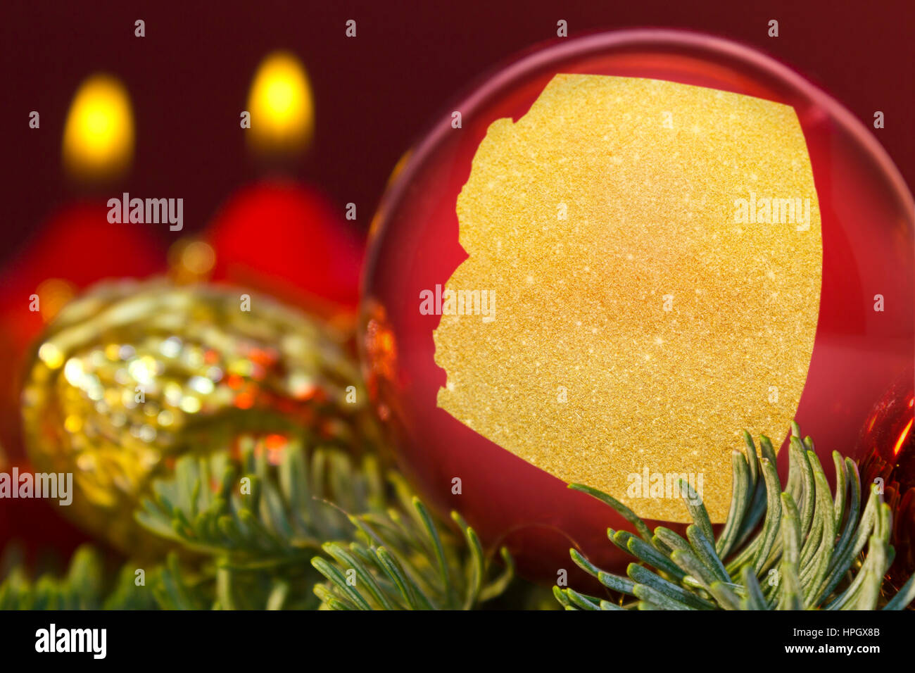 A glossy red bauble with the golden shape of Arizona.(series Stock ...