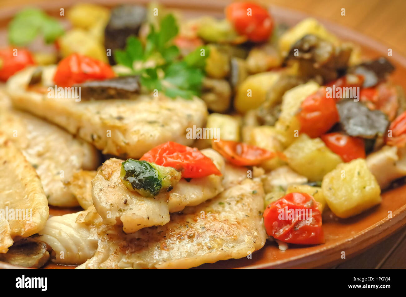 Cod fish with vegetables and potatoes Stock Photo - Alamy