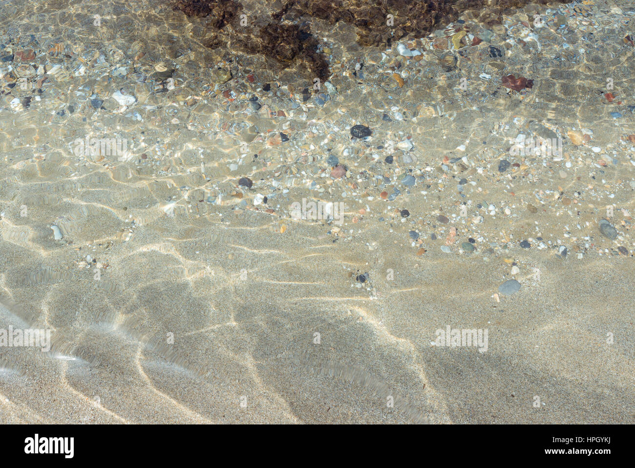 Shallow sea water with pebbles and sand substrate Stock Photo - Alamy