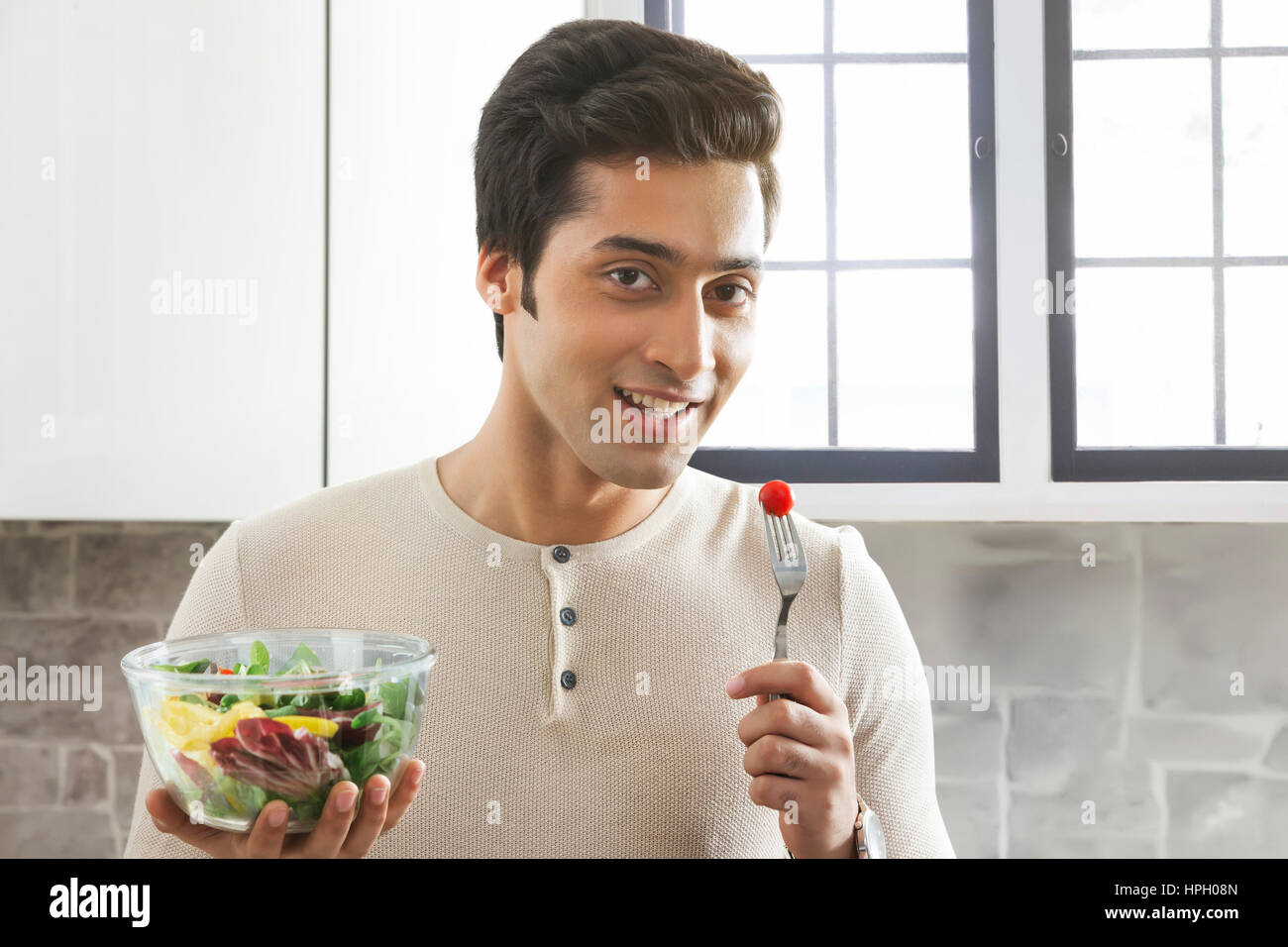 Indian man eating hi-res stock photography and images - Alamy
