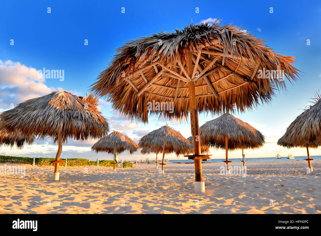 Amazing tropical holidays. Sun umbrellas on the beach. Tropical ...