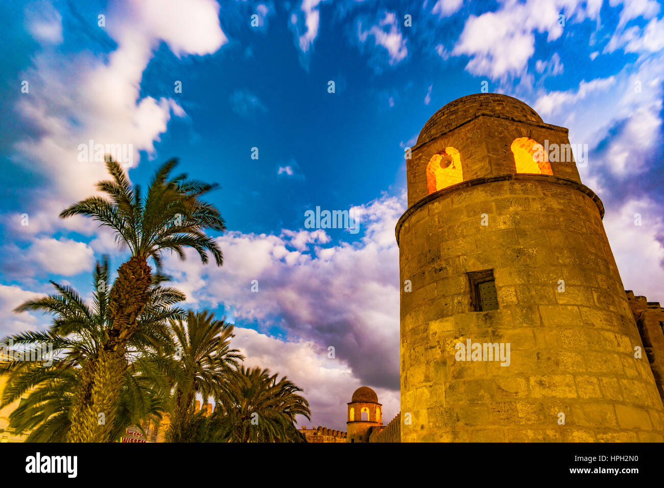 Night photo of Mosque in Sousse. Medieval architecture in night lights ...
