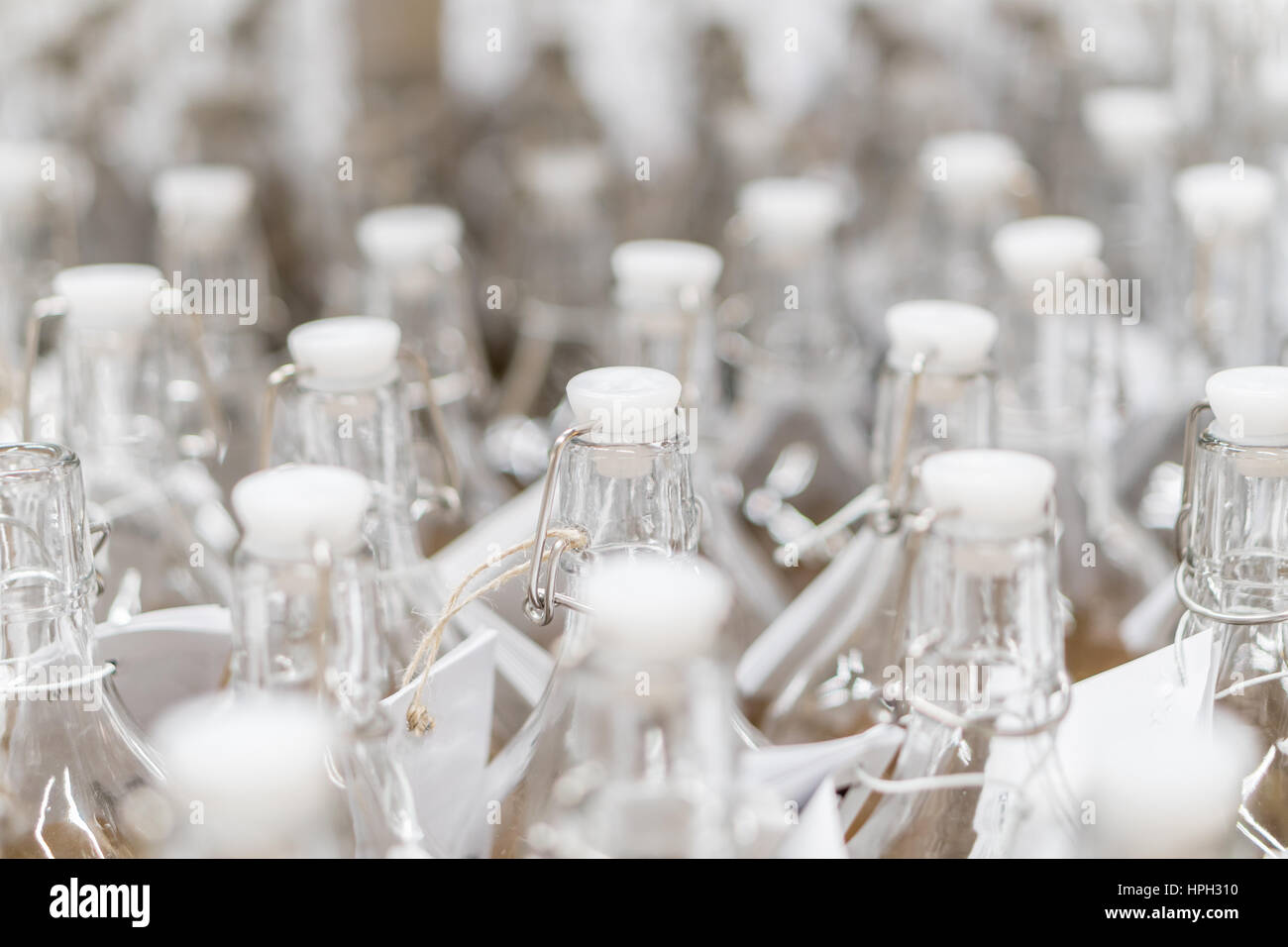 Empty glass bottles in factory to fill with drink Stock Photo - Alamy