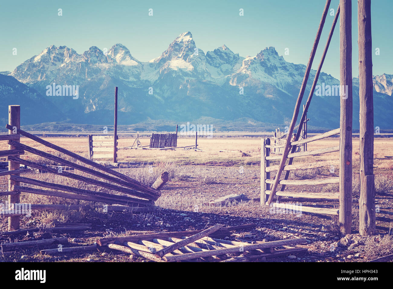 Vintage stylized wooden gate with mountain view, Grand Teton National ...