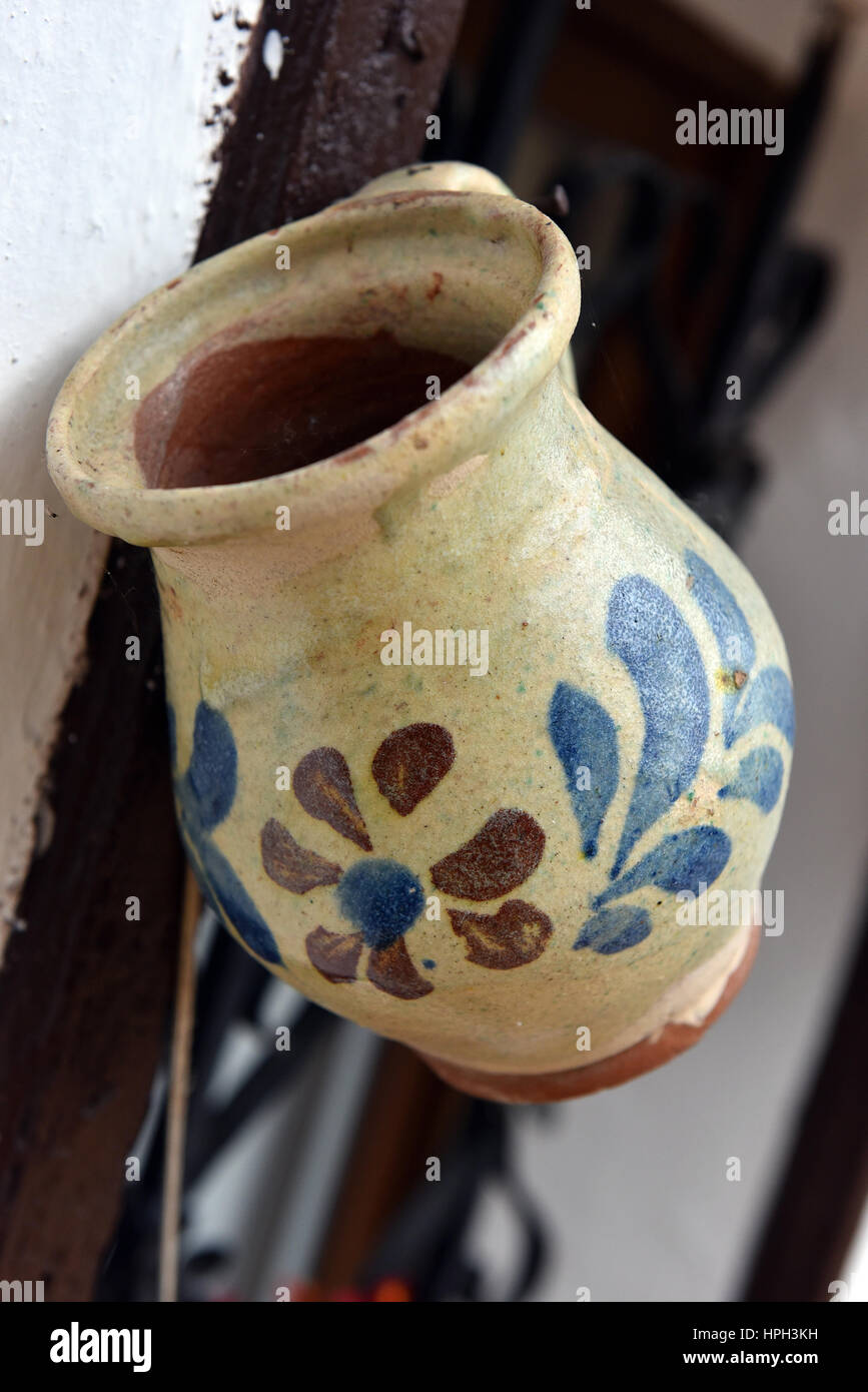 Hanging old, vintage clay jug, pot Stock Photo - Alamy