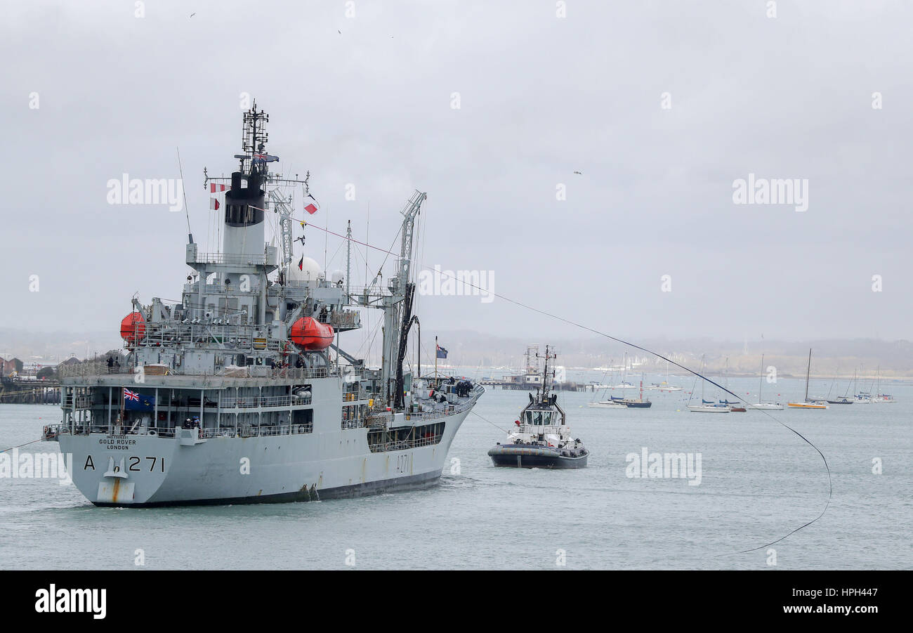 Royal Fleet Auxiliary Gold Rover enters Portsmouth Harbour flying a ...