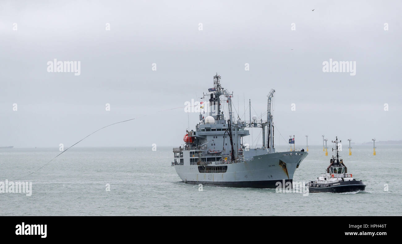 Royal Fleet Auxiliary Gold Rover enters Portsmouth Harbour flying a ...