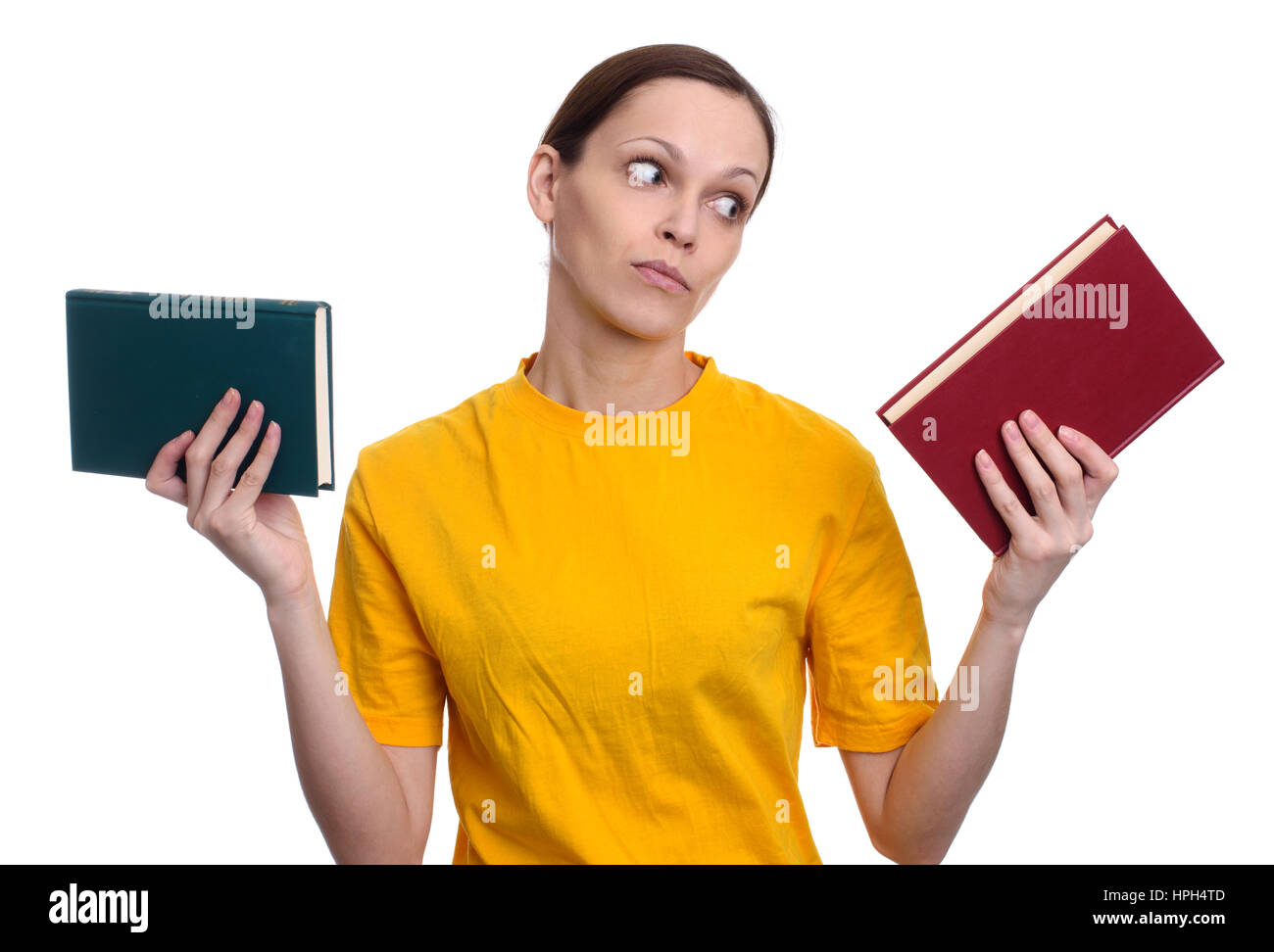 woman makes a choice between two books. Isolated Stock Photo - Alamy
