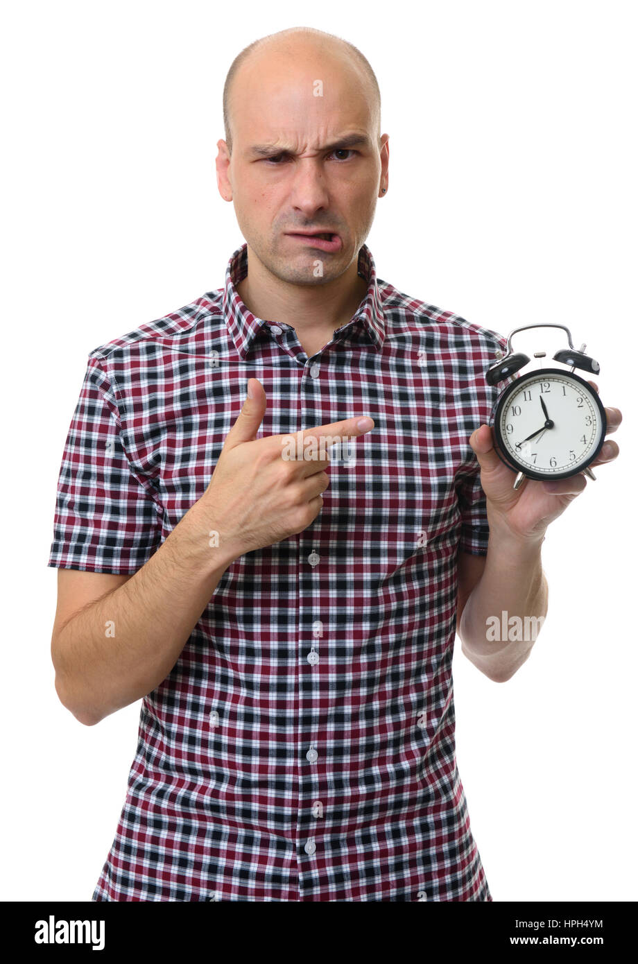 Angry bald man pointing to alarm clock. Isolated over white Stock Photo ...