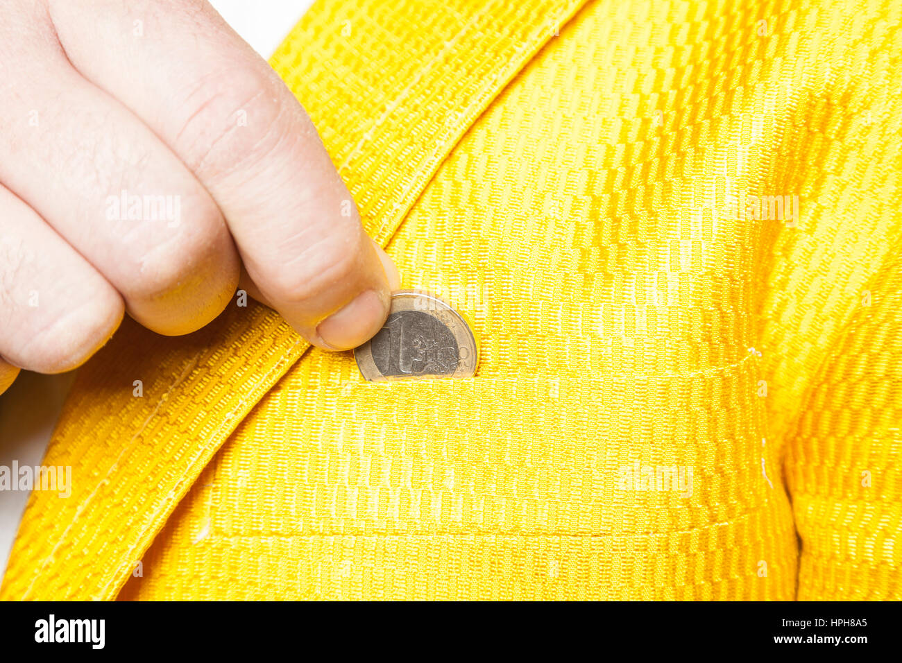 businessman puts the euro on the black hour Stock Photo - Alamy