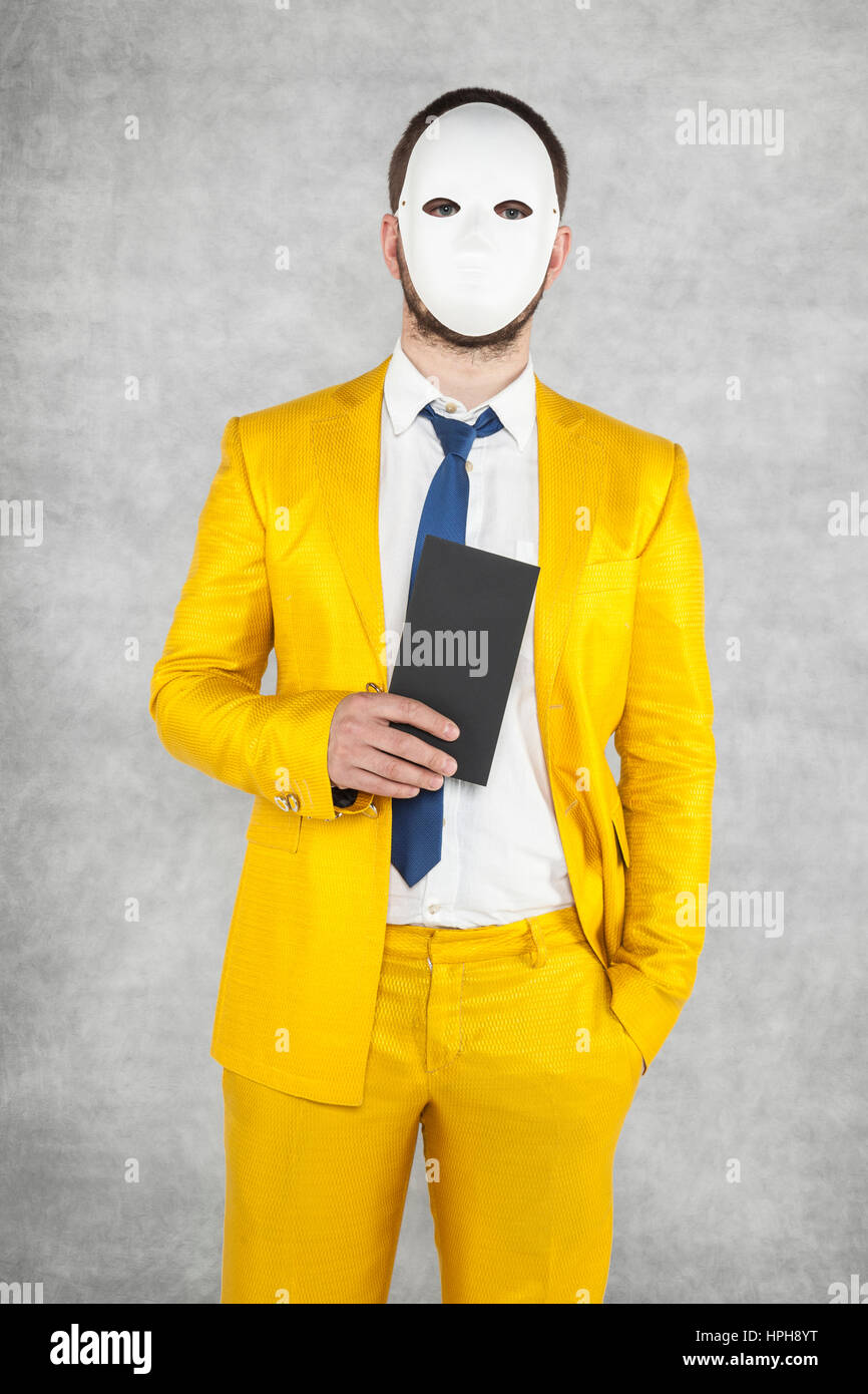 mysterious politician wearing a mask, holding an envelope with a bribe ...