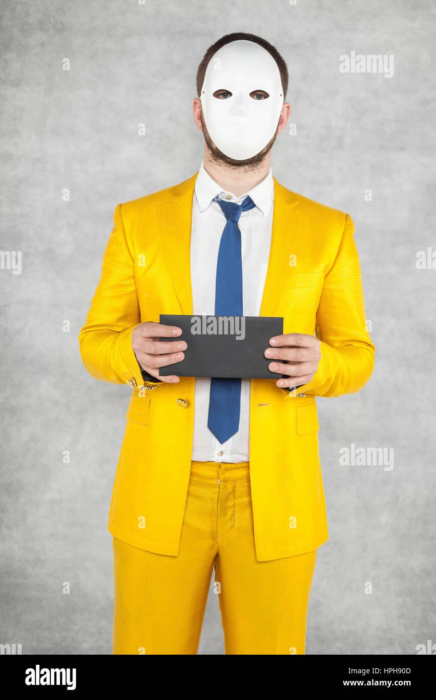 mysterious politician wearing a mask, holding an envelope with a bribe ...