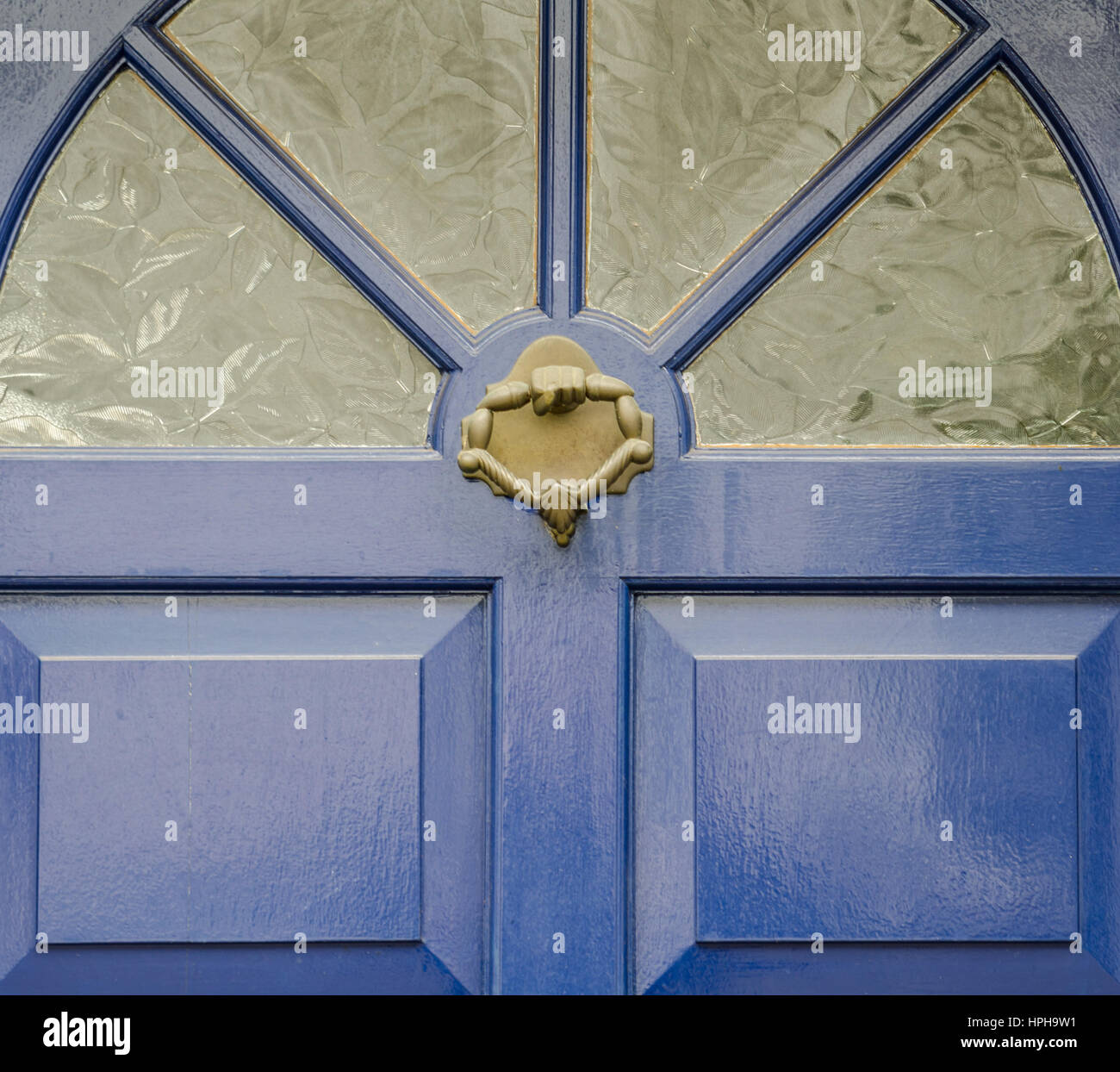 Original copper knocker in the shape of a hand holding a rope knocker ...