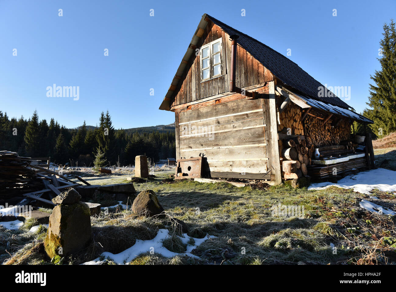 Wooden cottage in the mountains in a cold winter morning Stock Photo ...